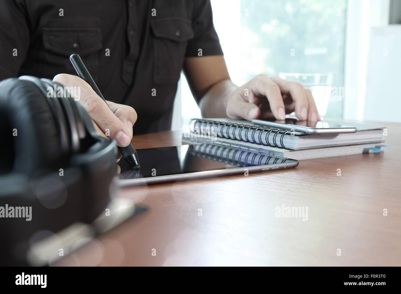 Close up of business man hand working on blank screen laptop computer ...