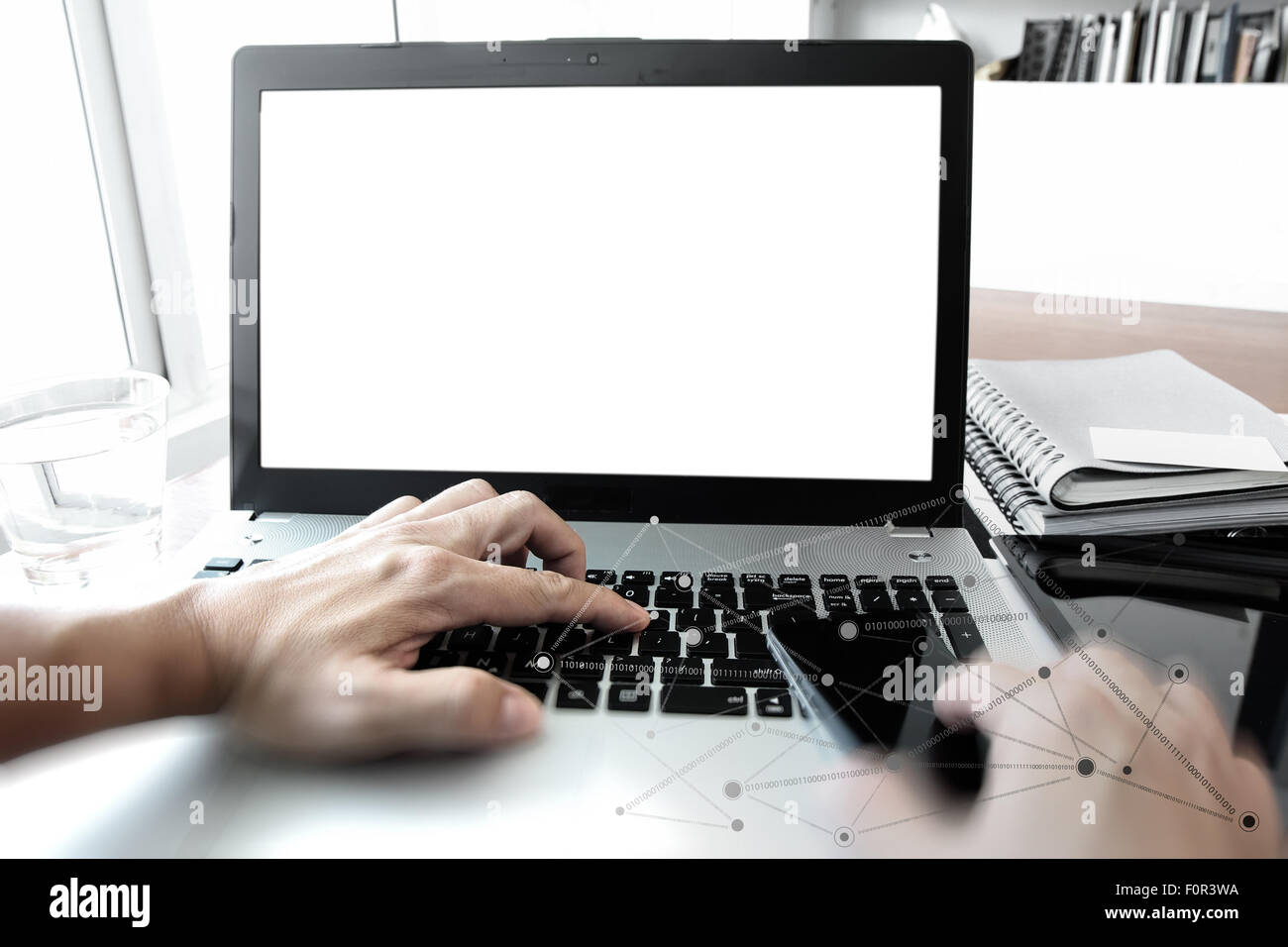 Close up of business man hand working on blank screen laptop computer ...
