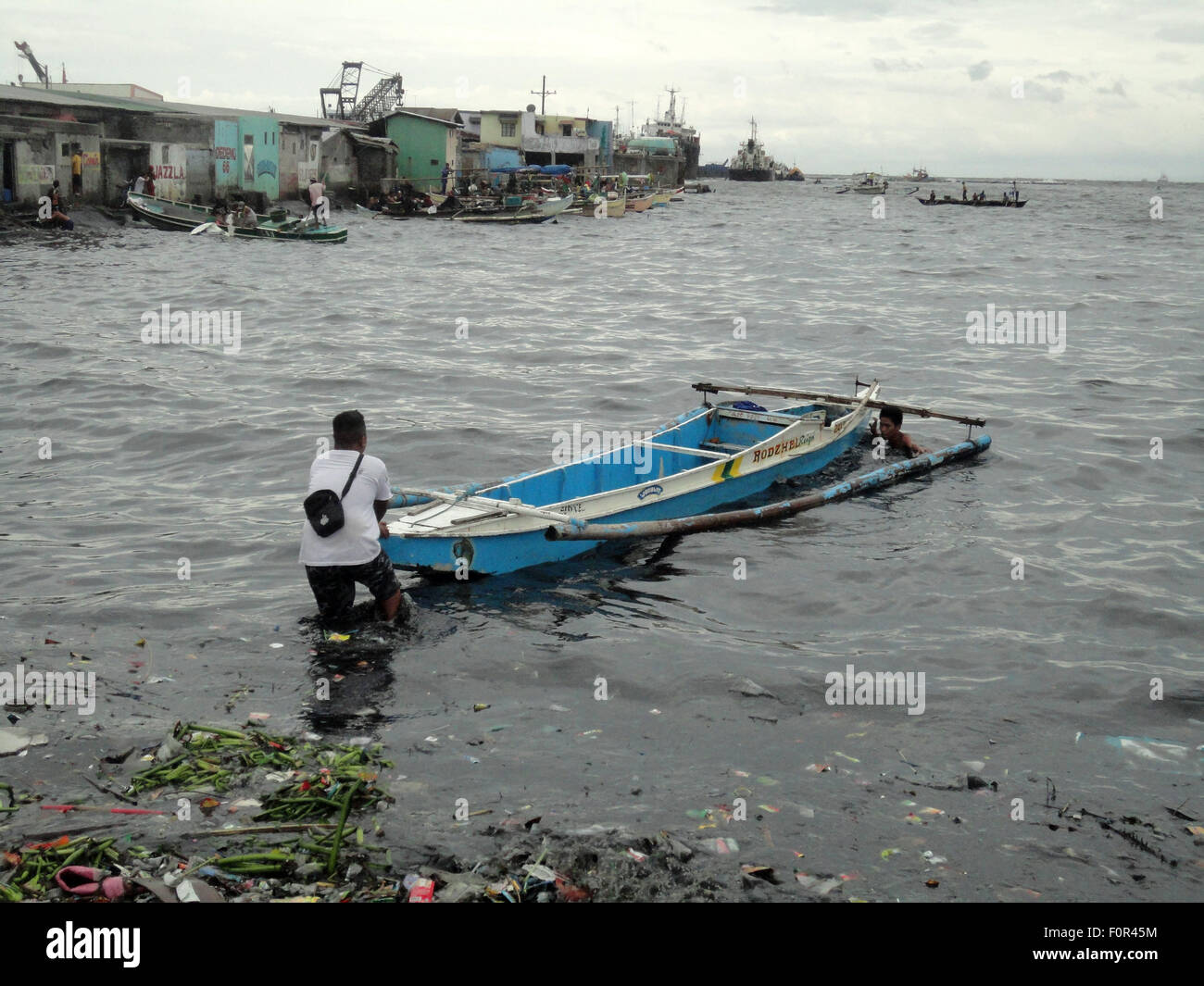 Filipino fishermen in boat in hi-res stock photography and images - Alamy