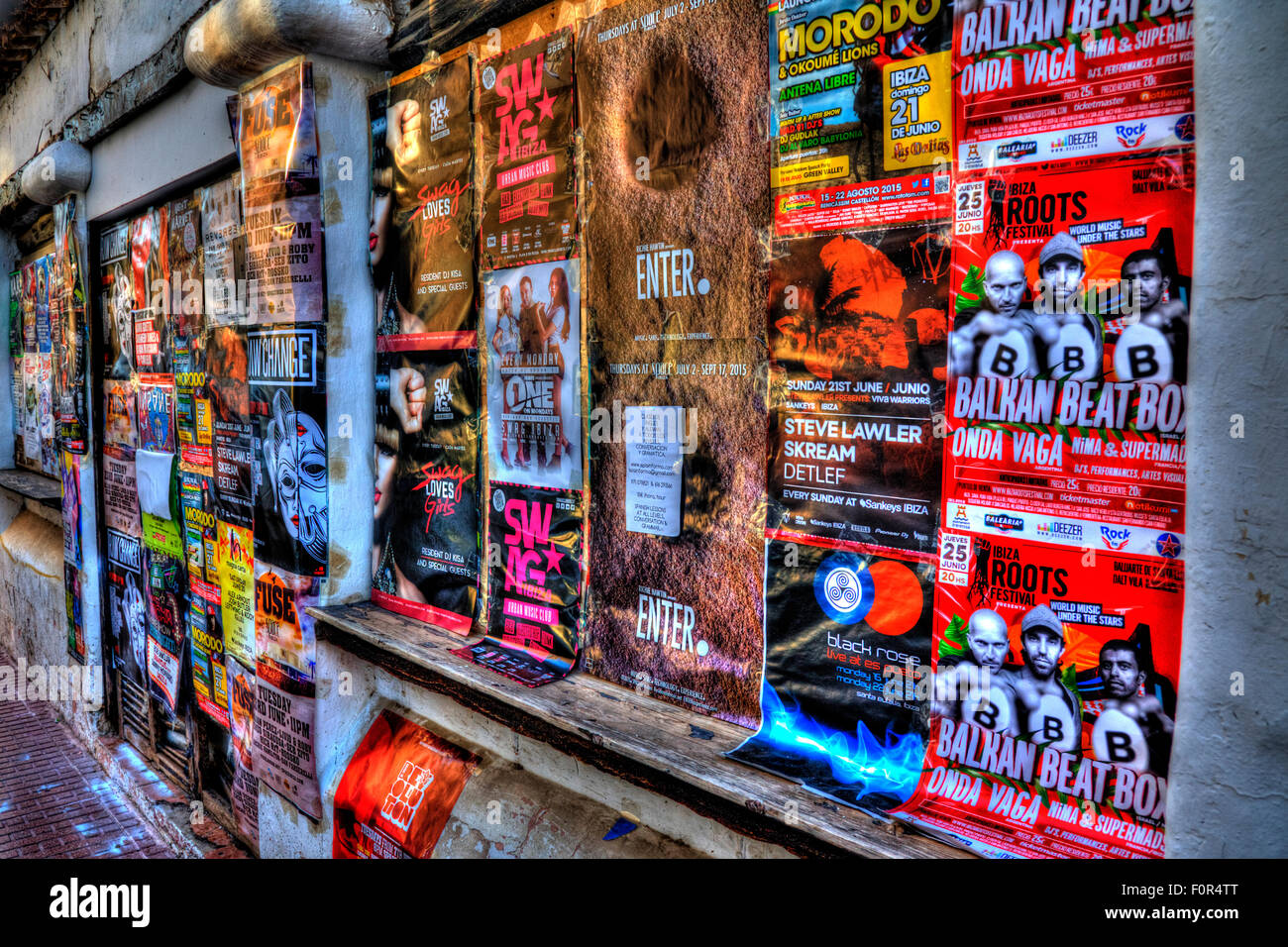 posters stuck on wall advertising bill posting adverts Ibiza clubs ...