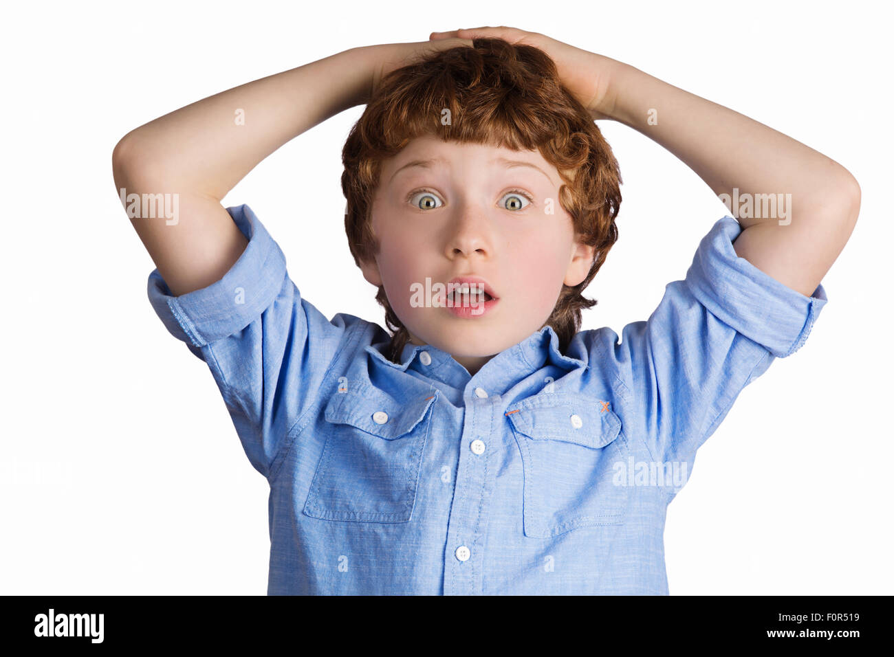 Handsome boy with surprised facial expression. Isolated on white ...