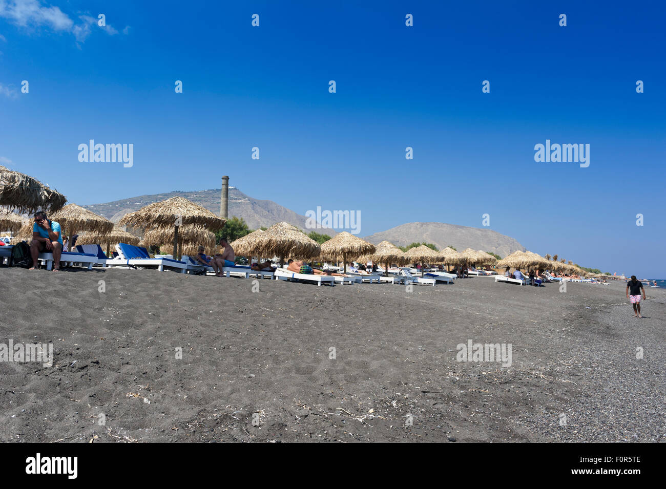 Perissa beach, one of Santorini popular beaches with black sand, Greece ...