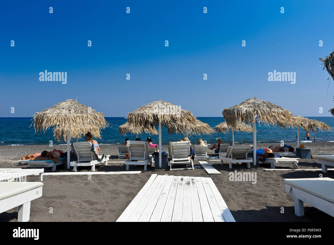 Perissa beach, one of Santorini popular beaches with black sand, Greece ...