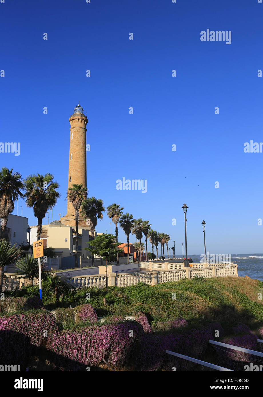 The promenade and lighthouse (Faro de Chipiona) at Chipiona, Cadiz ...