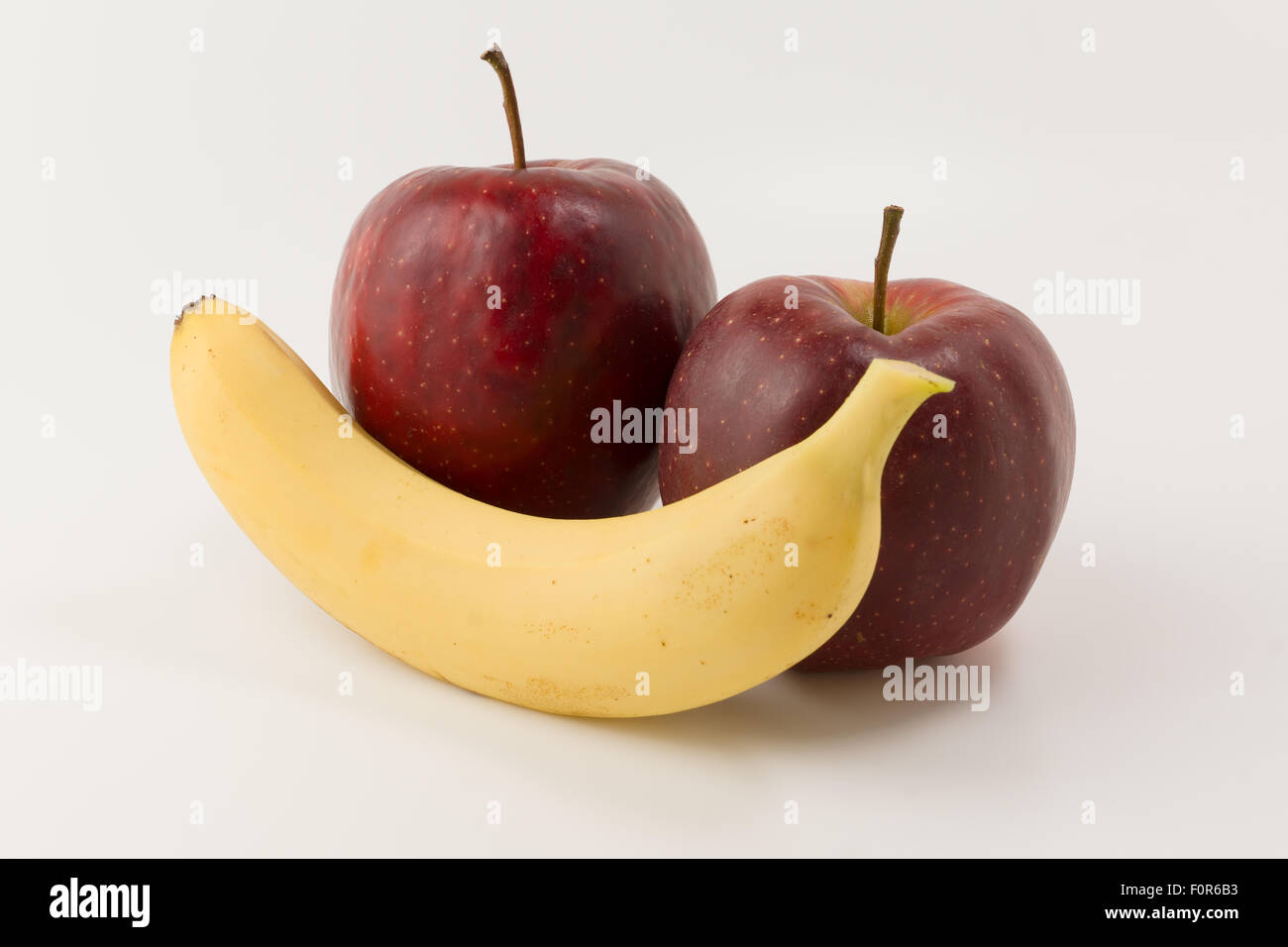 juicy fresh apples and banana lie on a white background Stock Photo - Alamy