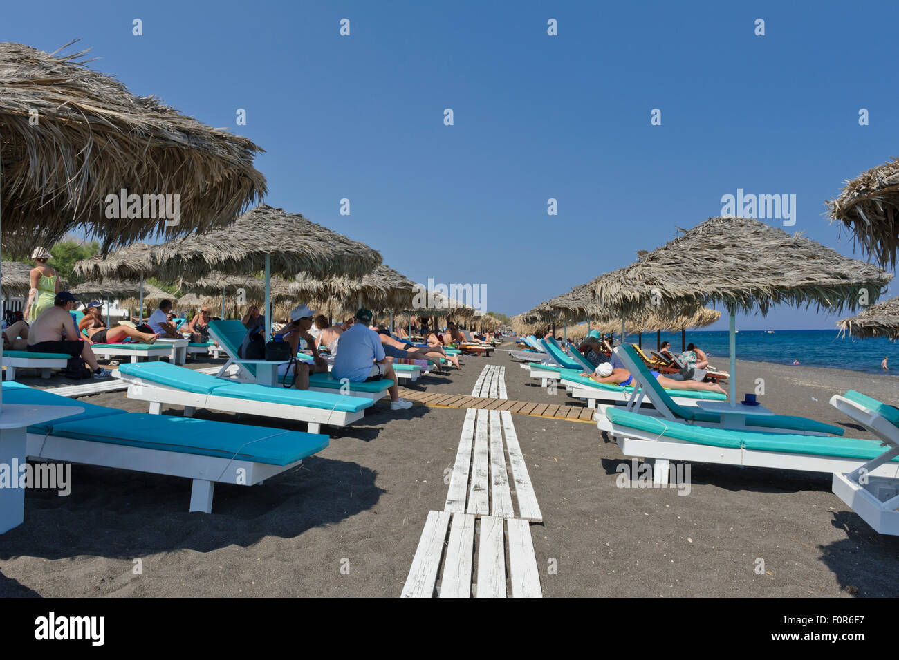 Perissa beach, one of Santorini popular beaches with black sand, Greece ...
