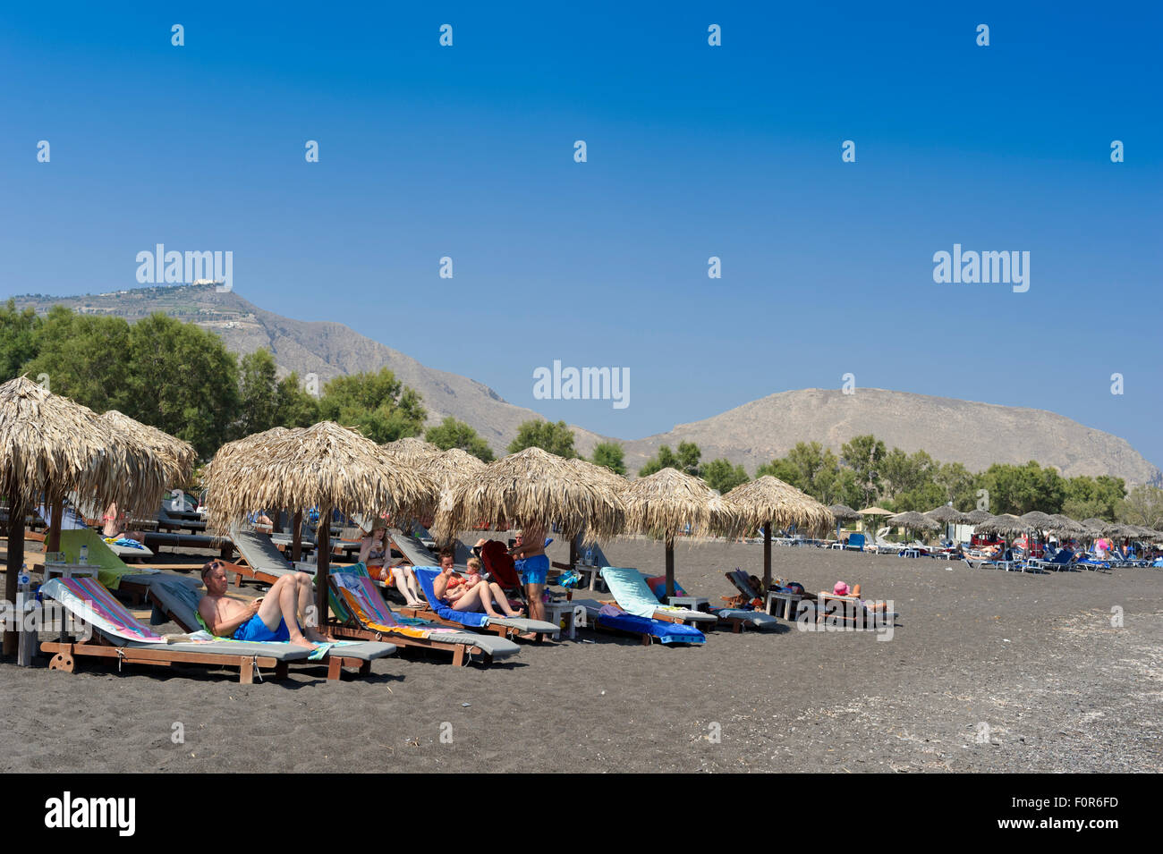 Perissa beach, one of Santorini popular beaches with black sand, Greece ...