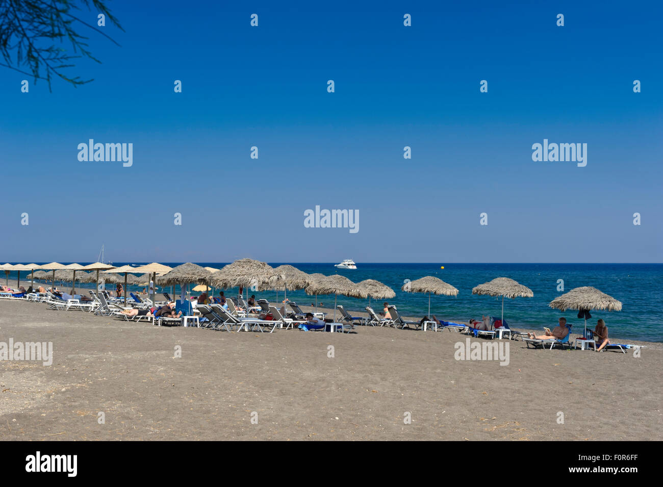 Perissa beach, one of Santorini popular beaches with black sand, Greece ...