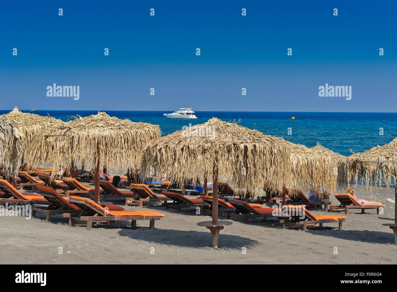 Perissa beach, one of Santorini popular beaches with black sand, Greece ...