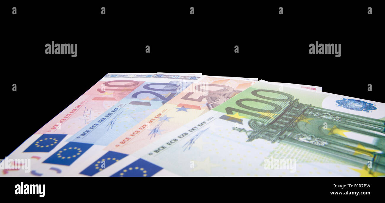 Various euro notes isolated on black background Stock Photo - Alamy