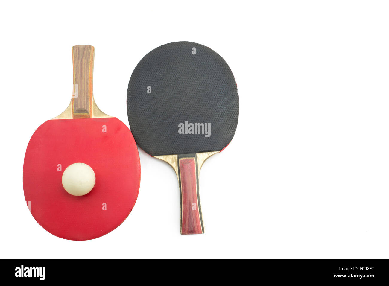 Two ping-pong rackets and a ball isolated on white Stock Photo - Alamy