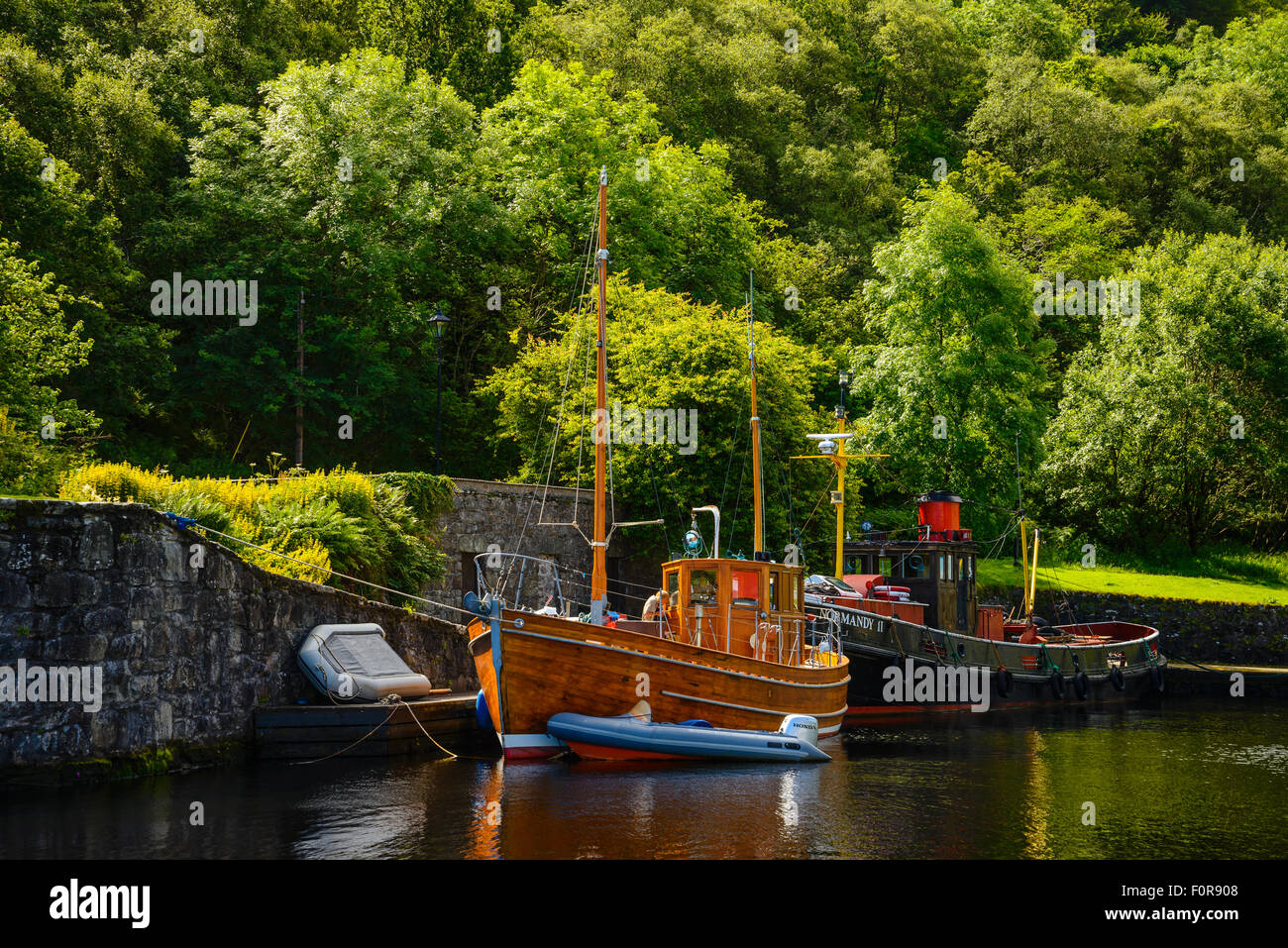 Traditional boat known as a puffer at Crinan Argyll Scotland at one end ...