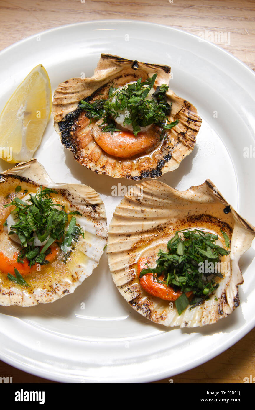 Wood roast scallops with sweet herbs and garlic butter Stock Photo - Alamy