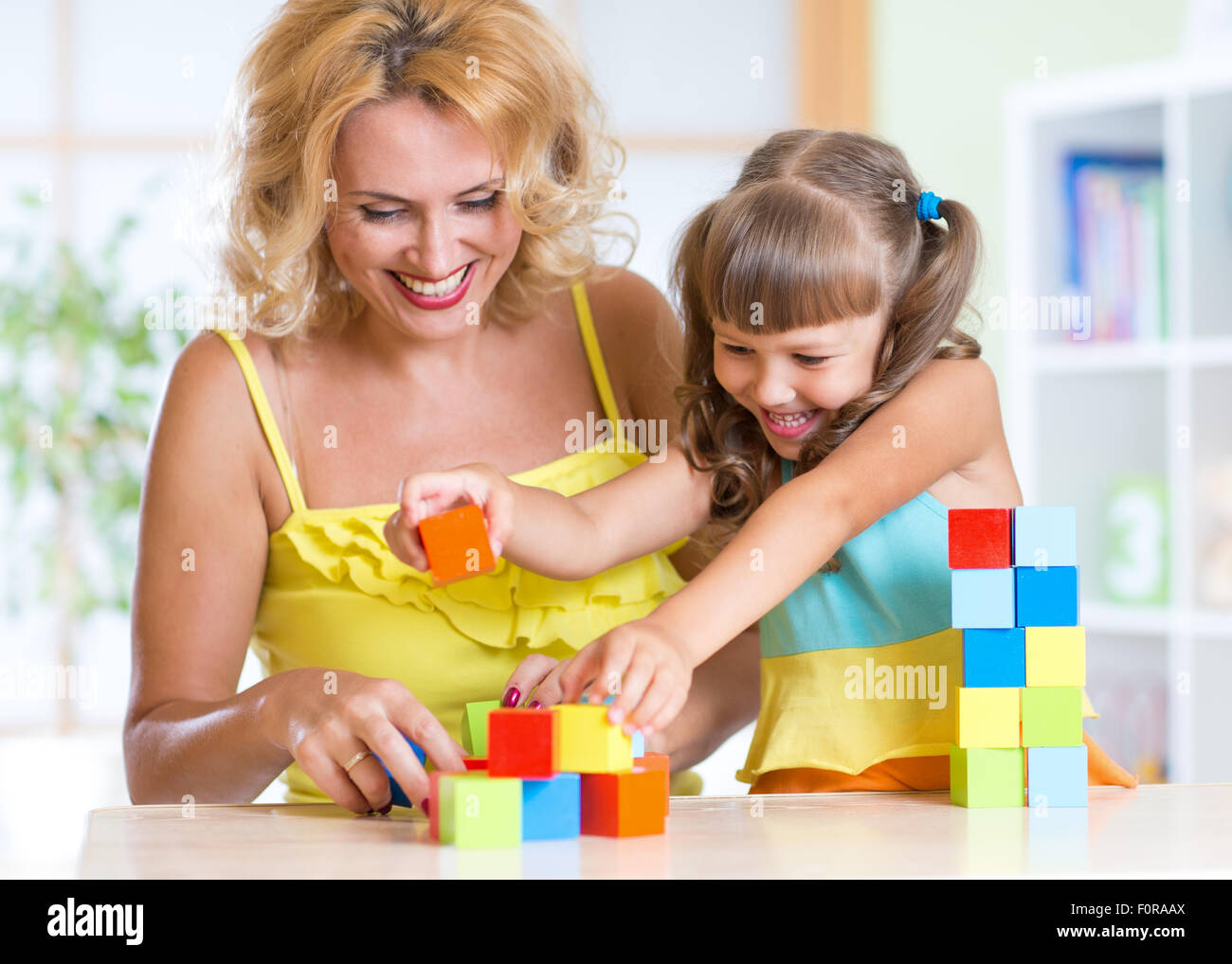mother with his child girl play together Stock Photo - Alamy