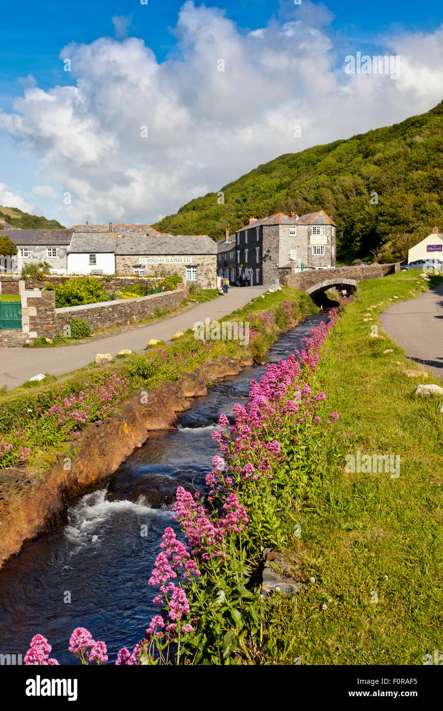 The Valency River lined with red valerian flowers runs through ...