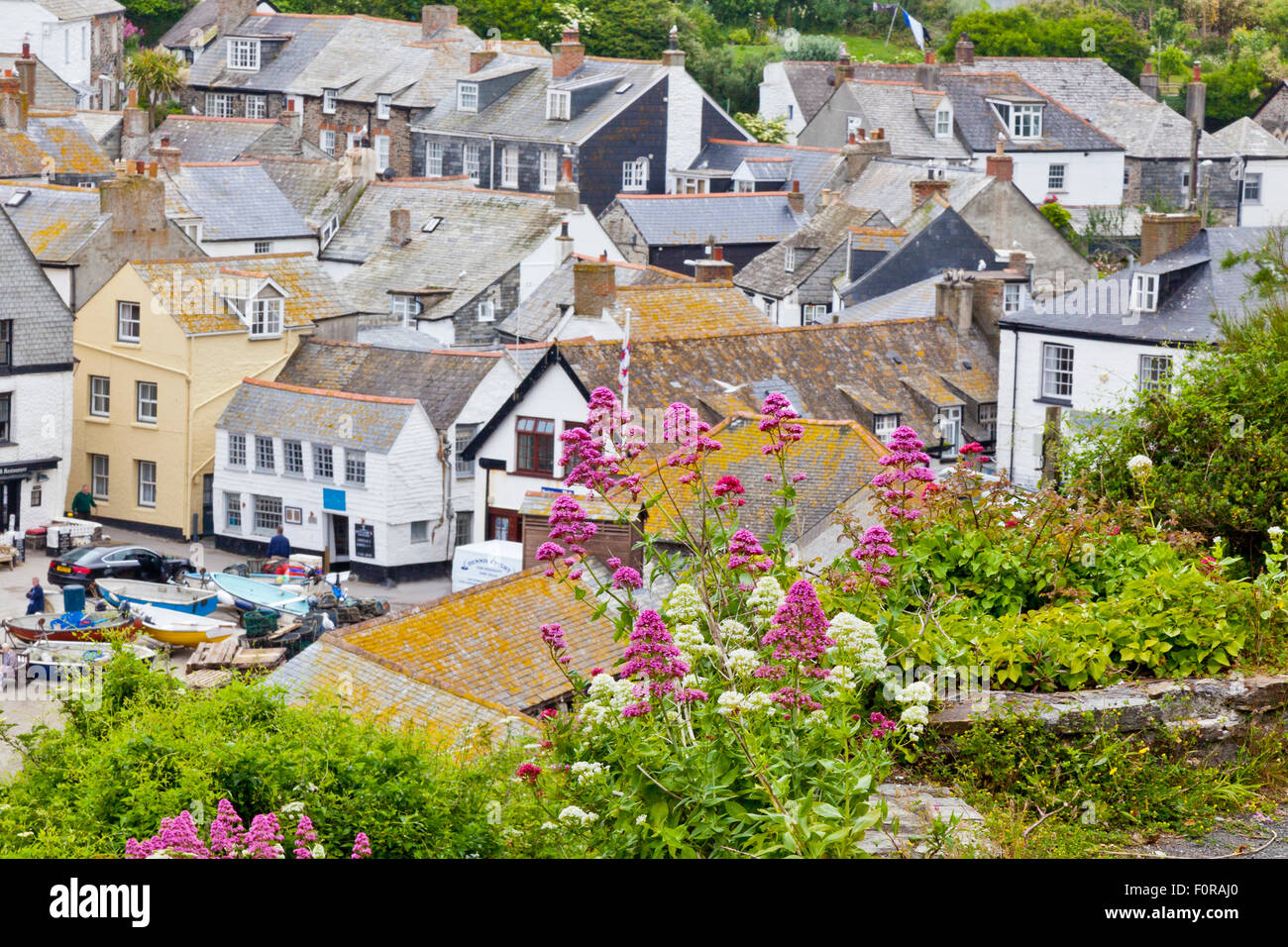 Small cottages cluster around the attractive fishing harbour in Port ...
