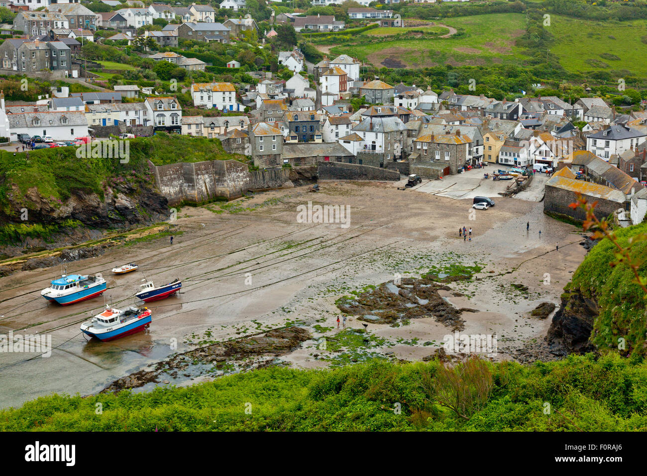 Small cottages cluster around the attractive fishing harbour in Port ...