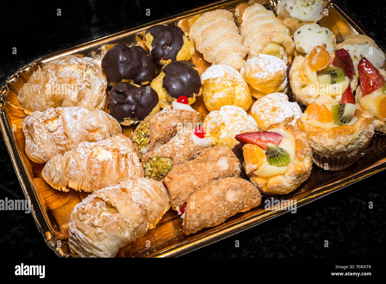 colorful pastries with fruits, cream and chocolate, the real Italian ...