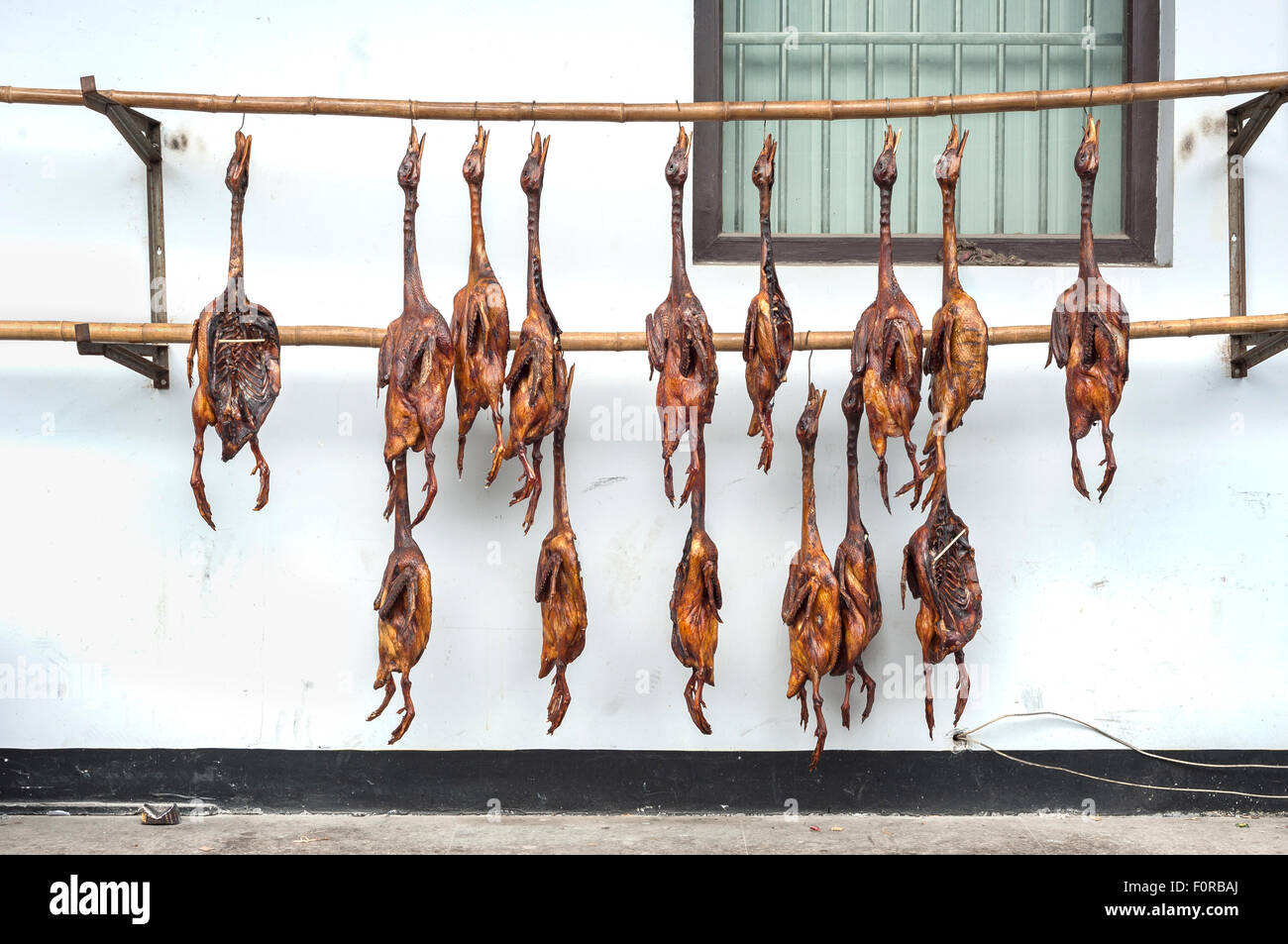 Prepared geese drying outdoors in a rural Chinese town Stock Photo - Alamy