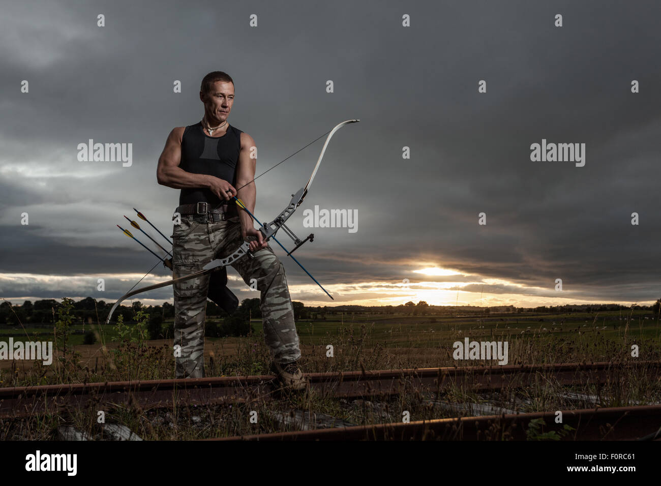 Person with bow and arrow hi-res stock photography and images - Alamy