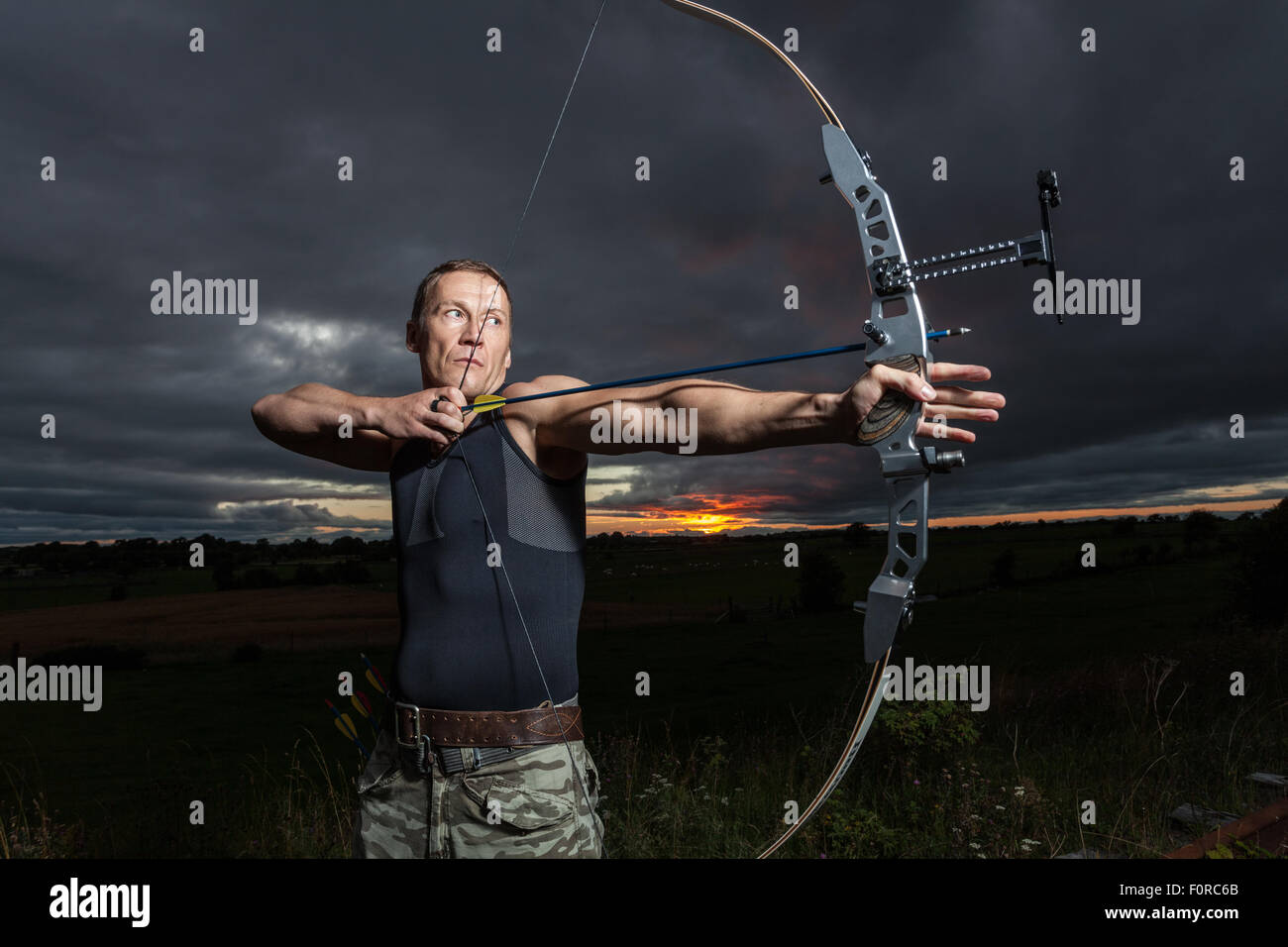 Man aiming bow arrow man hi-res stock photography and images - Alamy