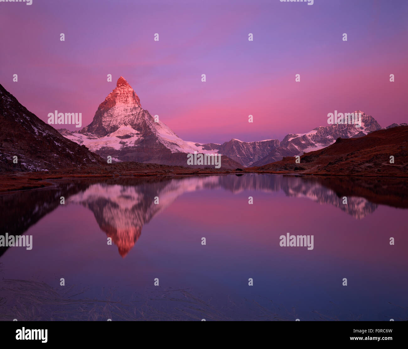 Matterhorn (4,478m) with reflection in Lake Riffel at sunrise ...