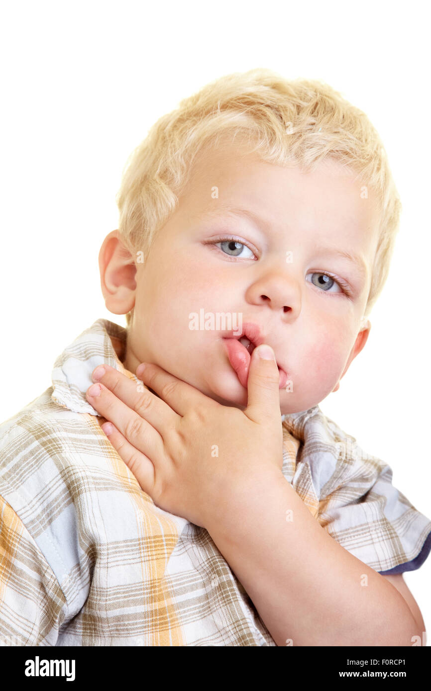 Pensive boy touching his mouth Stock Photo - Alamy