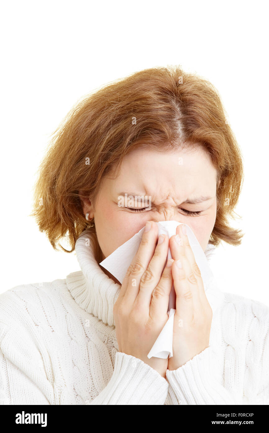 Woman cleaning her nose with a tissue Stock Photo - Alamy