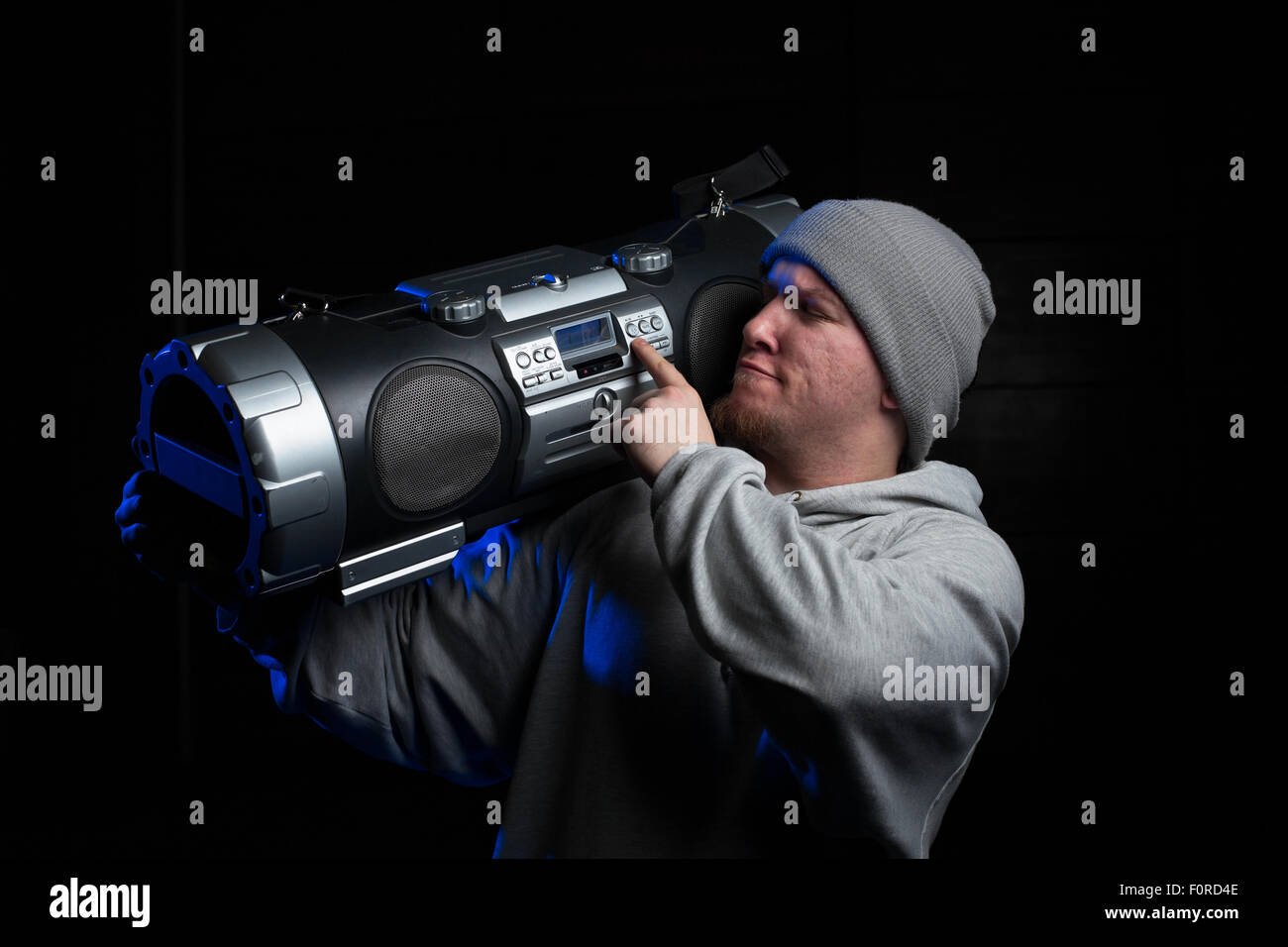 Young man, a dancer, posing with vintage boombox Stock Photo - Alamy