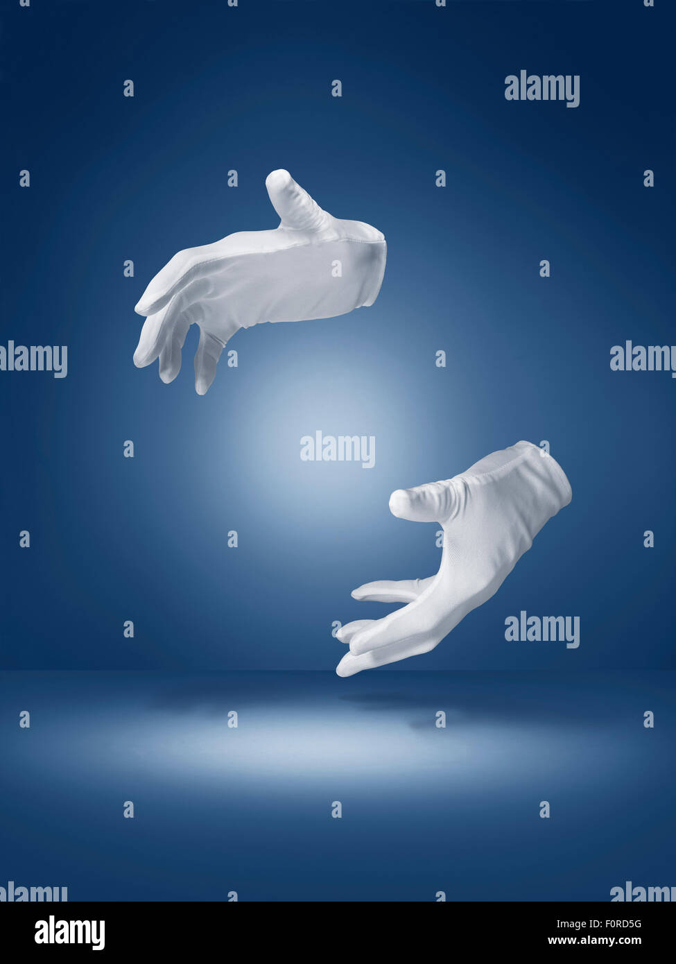 Magicians Hands performing trick Stock Photo - Alamy