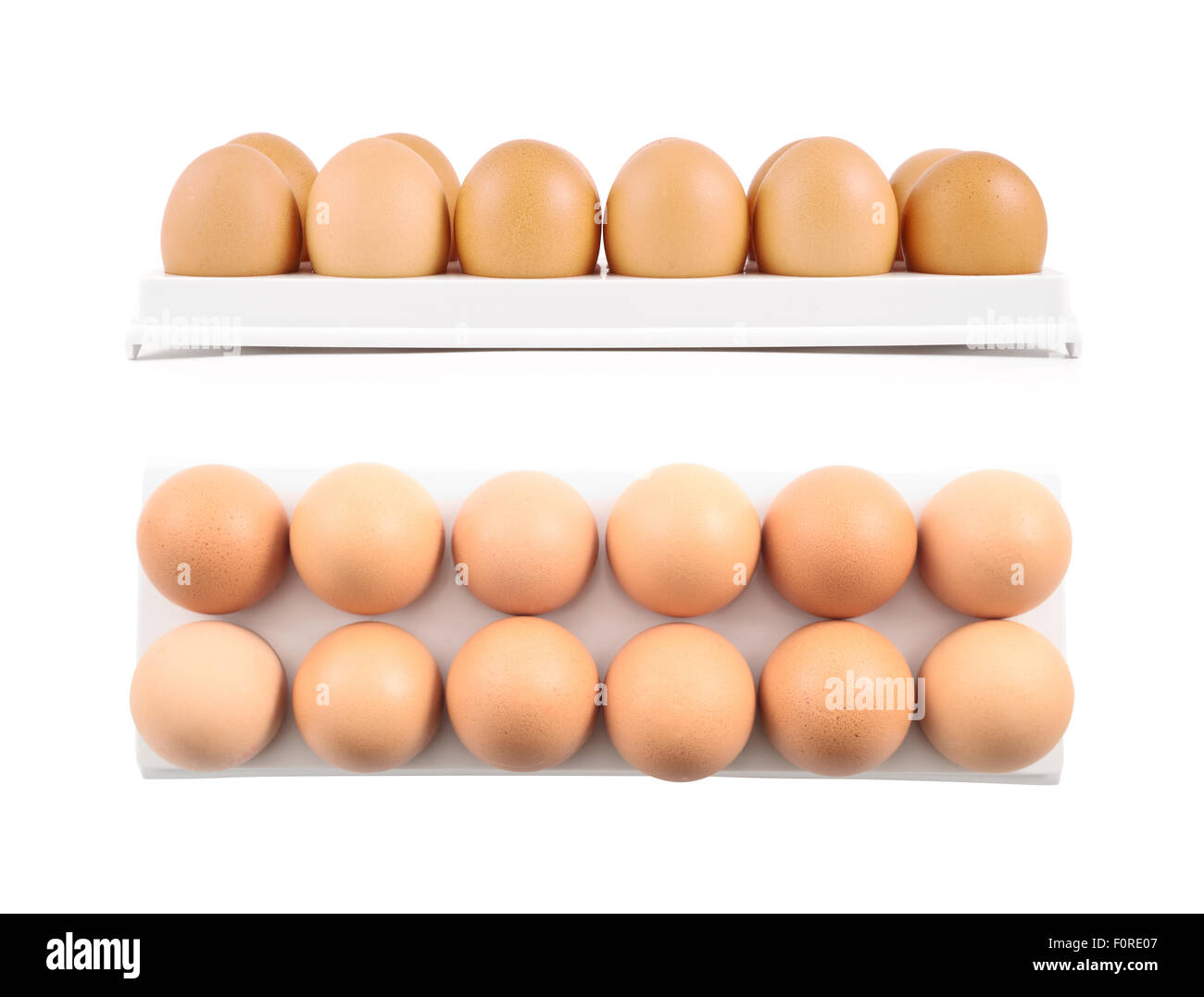Dozen, twelve eggs in a special plastic case isolated over white ...