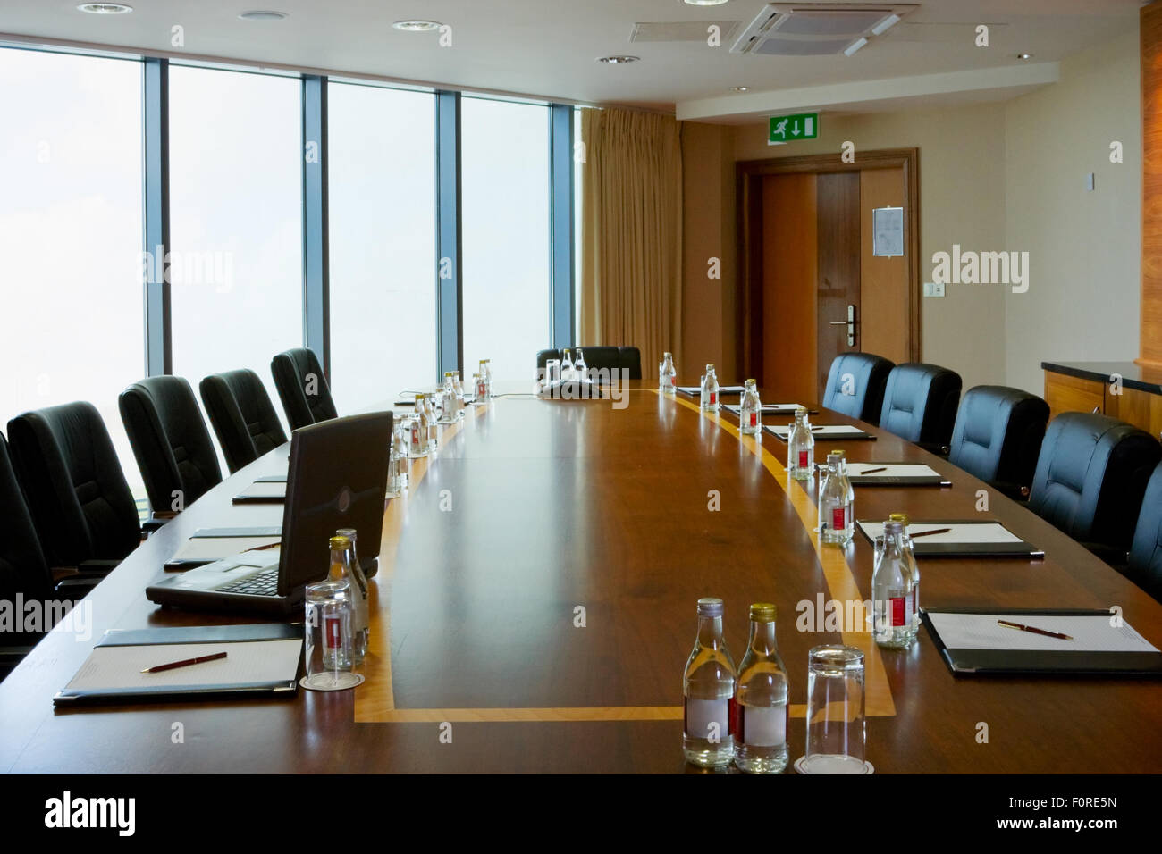 conference hall Interior with table, raw of chairs and block-notes ...