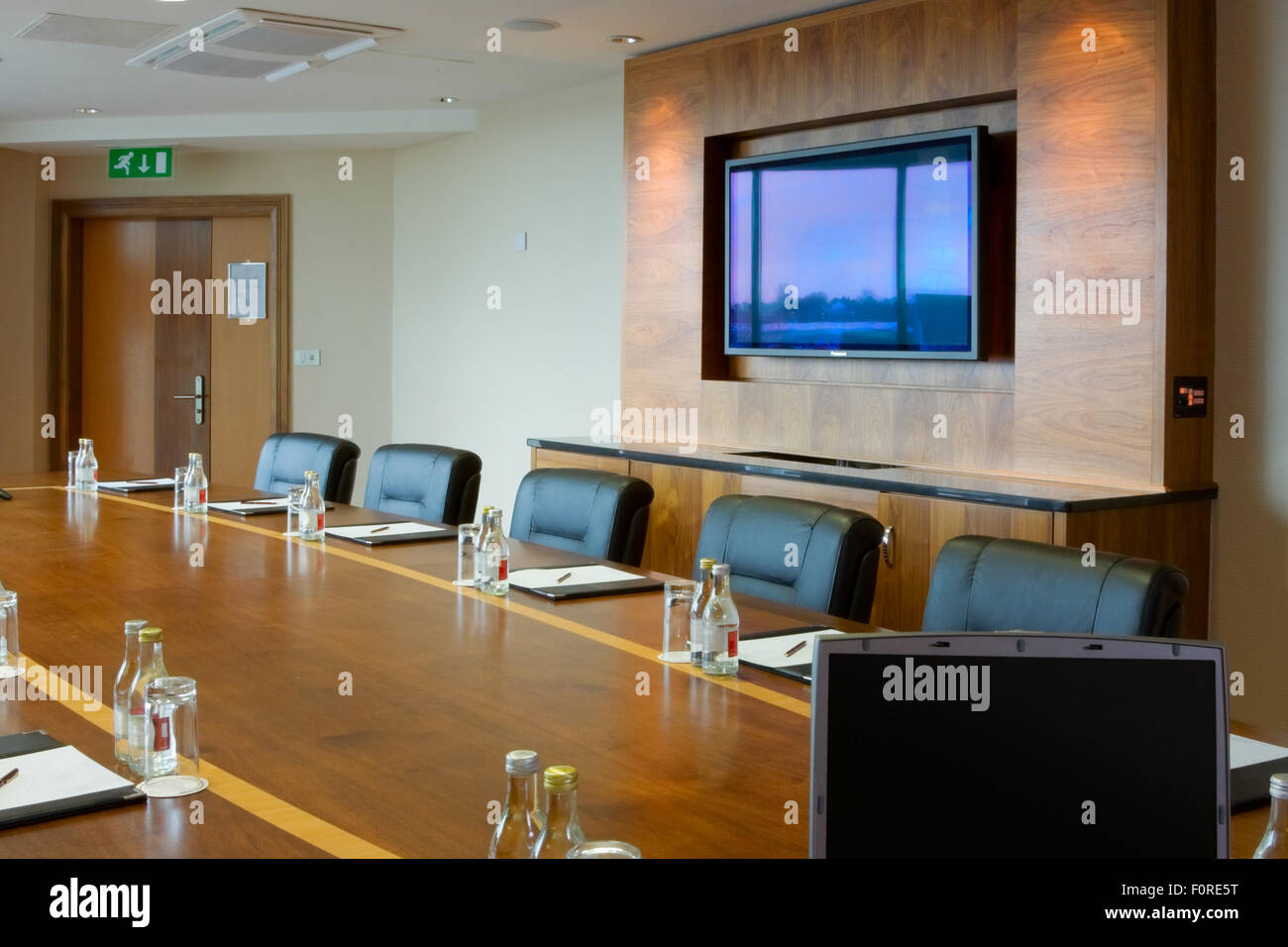 conference hall Interior with laptop on the table and big screen on the ...