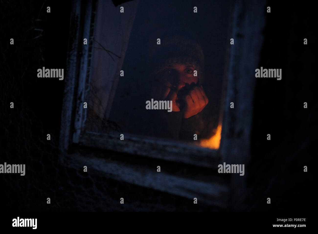 Photographer, Vincent Munier, looking through window, Forollhogna ...