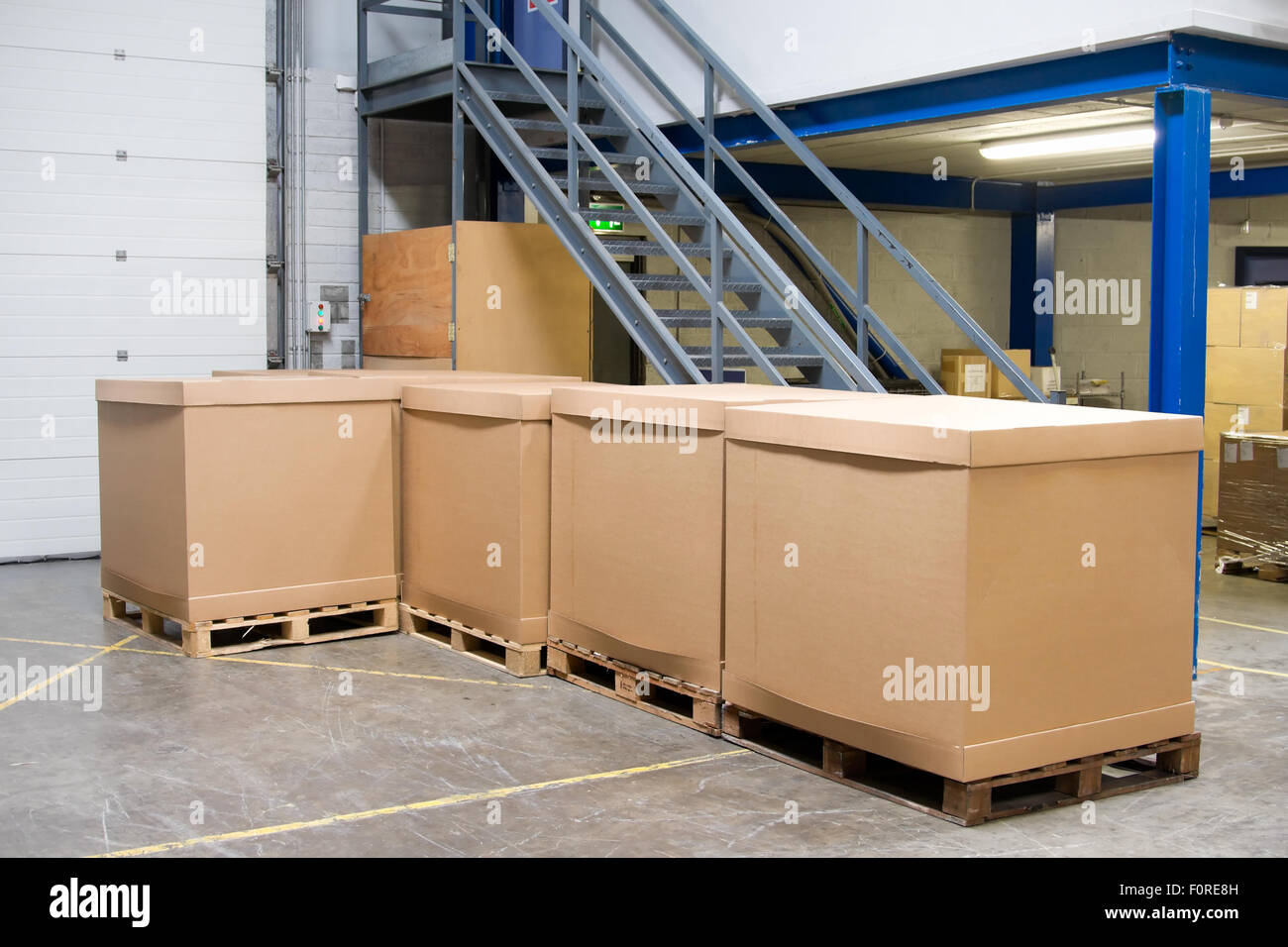 industrial warehouse interior and pallets with cardboard cartons Stock ...