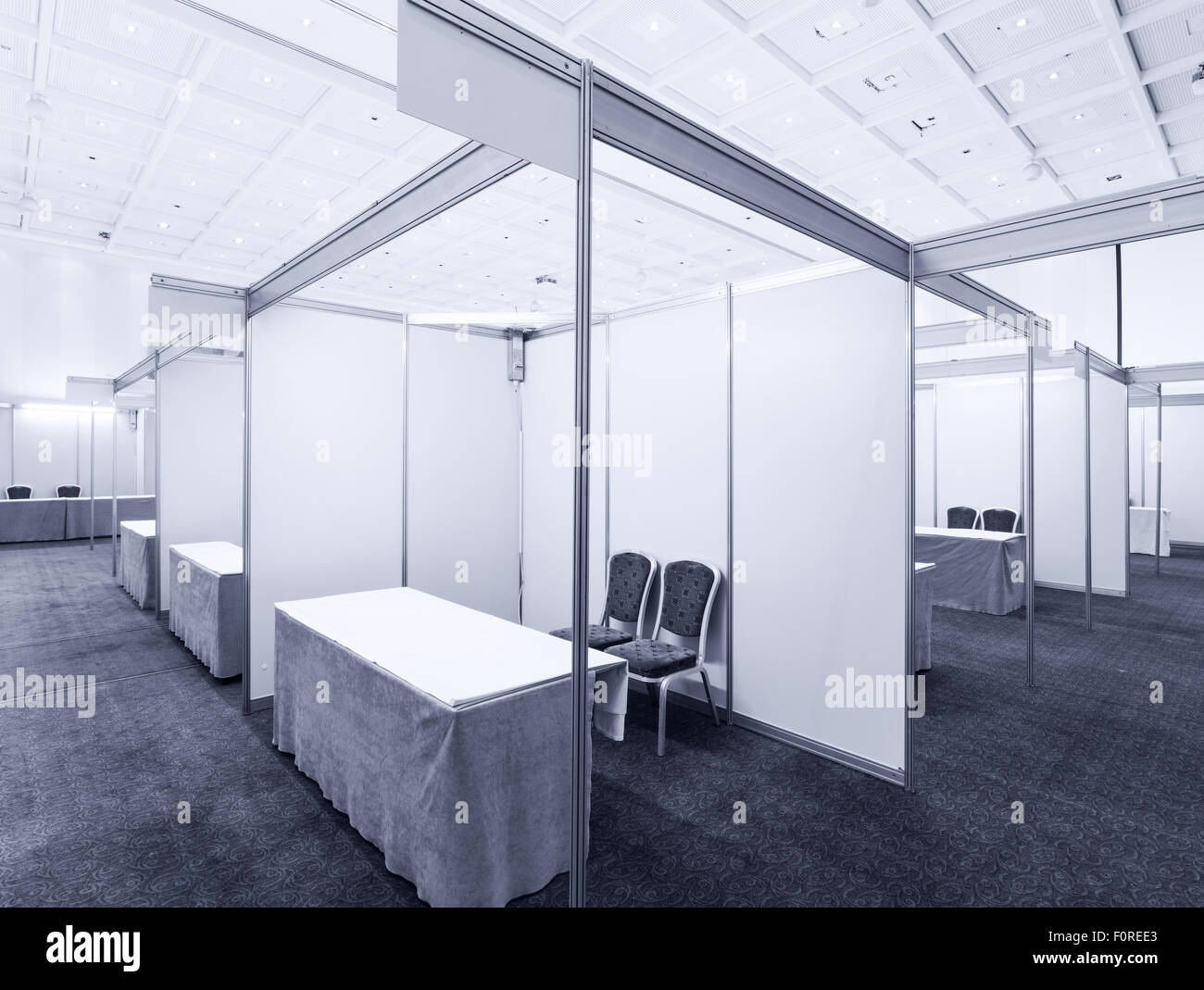 Trade show interior with booth and tables Stock Photo - Alamy