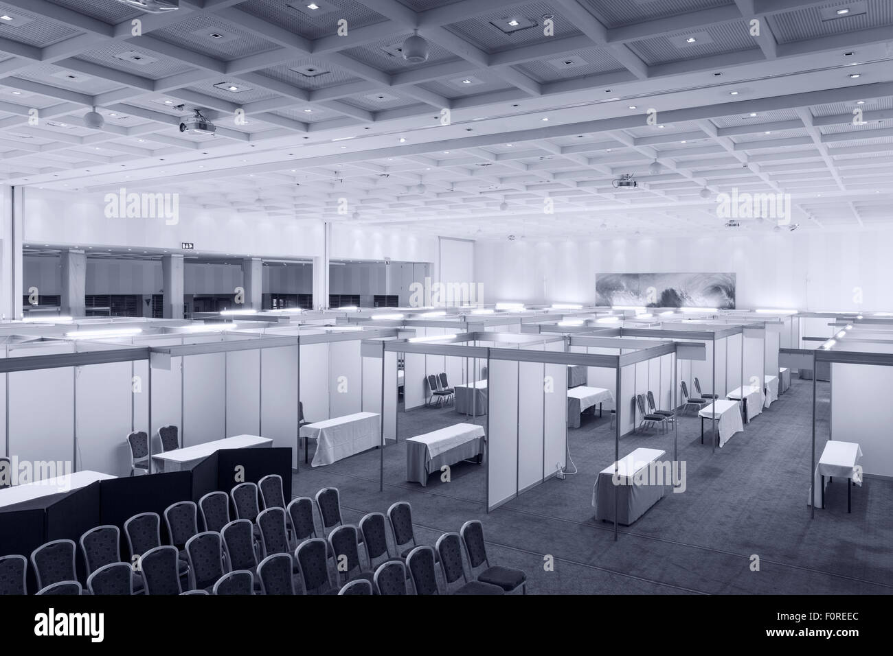 Trade show interior with booth and tables Stock Photo - Alamy