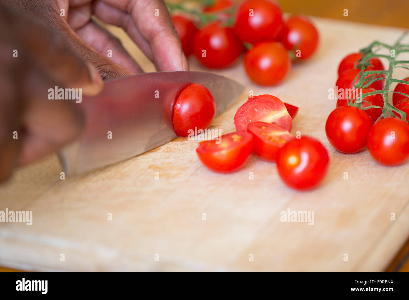 Chopped red cherry tomatoes black hi-res stock photography and images - Alamy