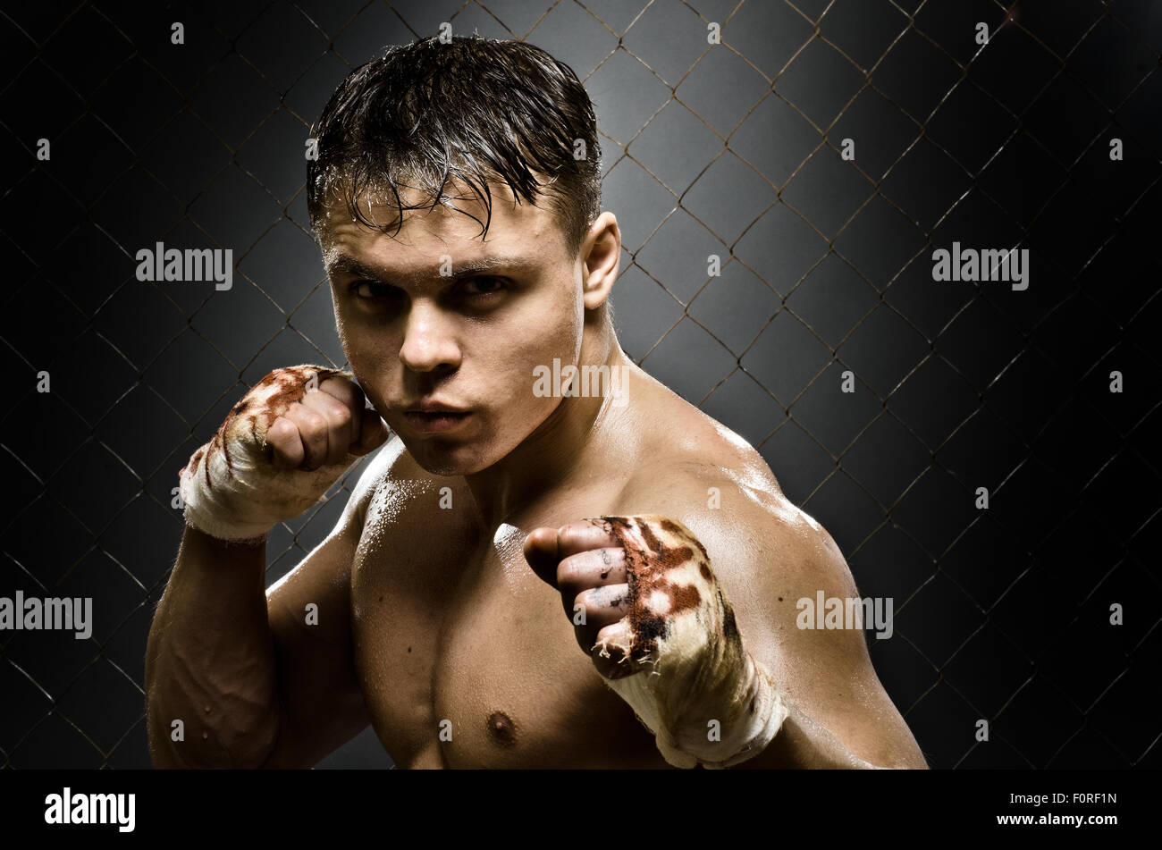 vertical photo muscular young guy street-fighter, aggression look, hard ...