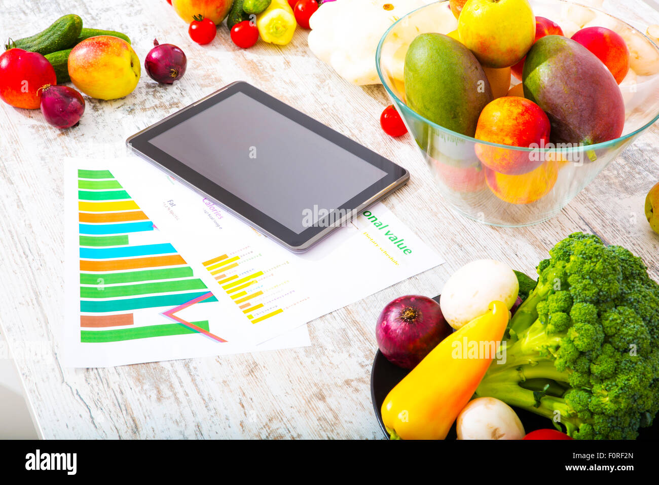 Organic fruit and vegetable on the table with a tablet PC Stock Photo ...