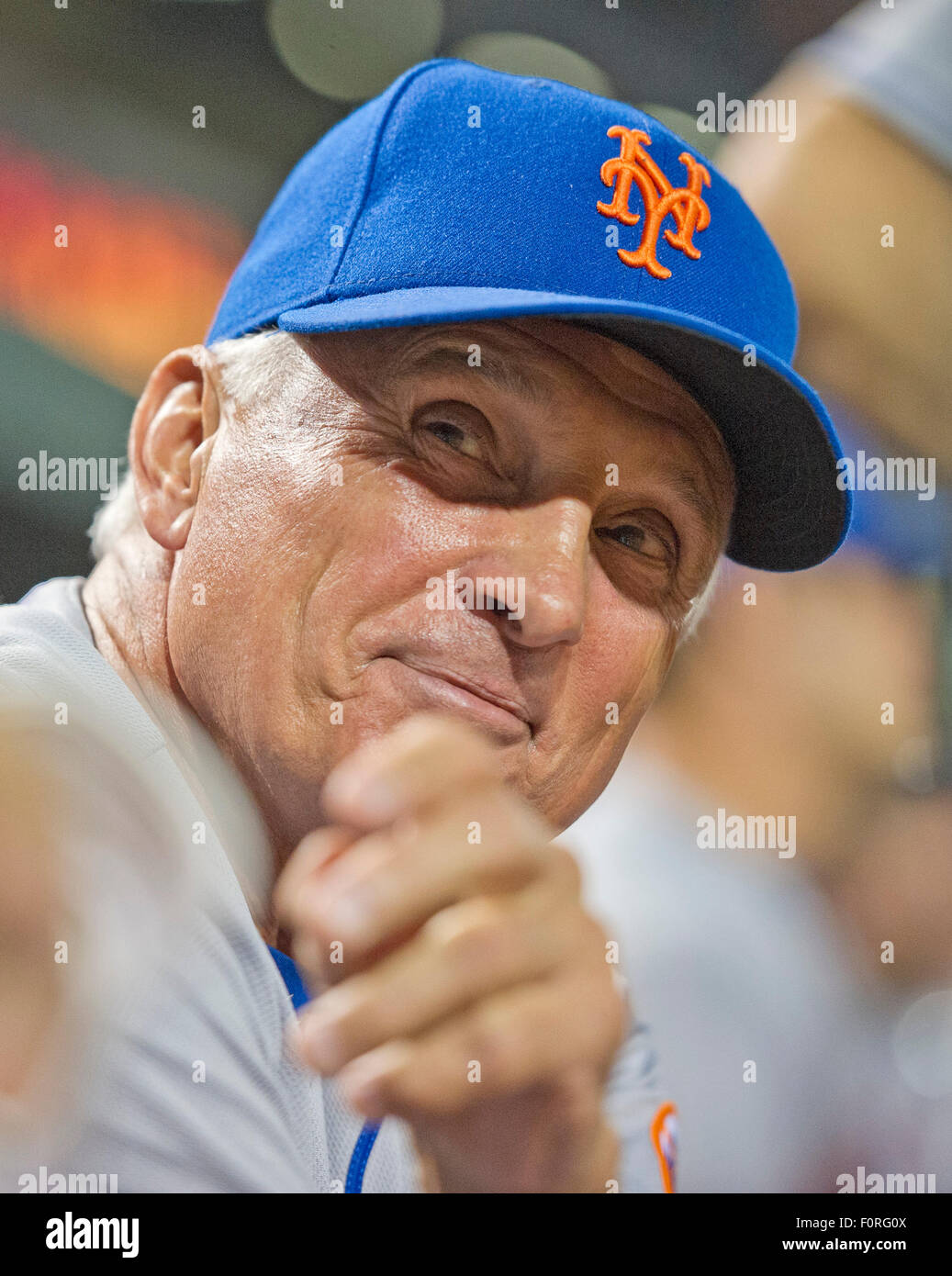 New York Mets manager Terry Collins (10) smiles as he watches the ...