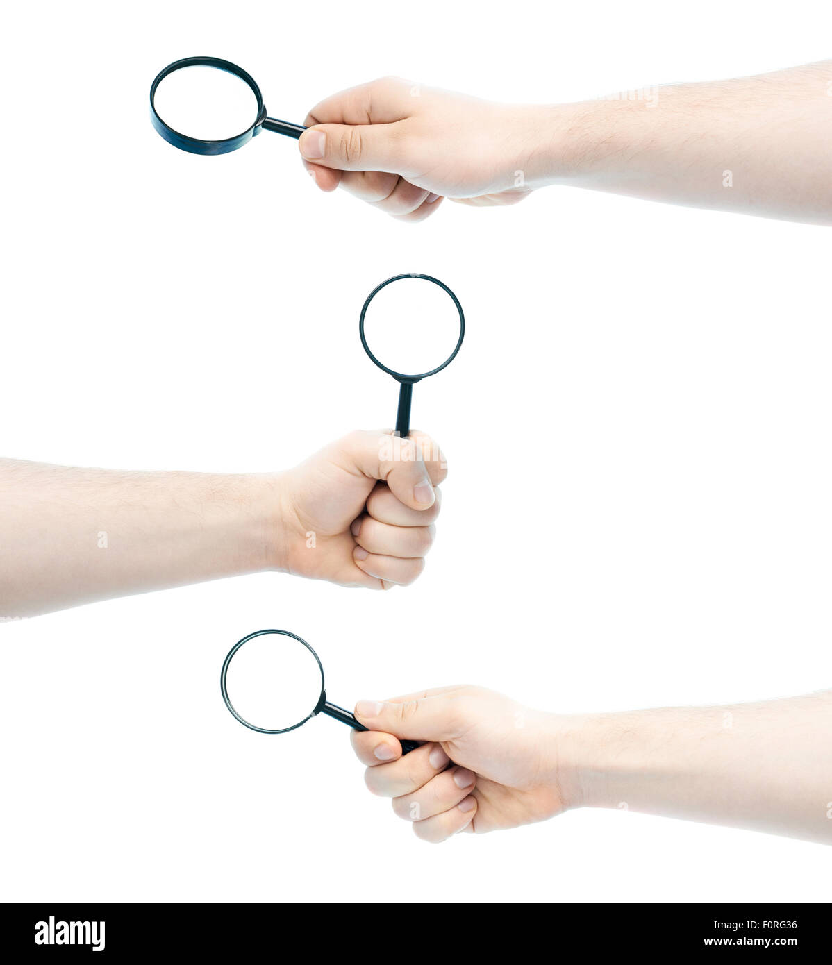 Caucasian male hand holding magnifying glass Stock Photo - Alamy