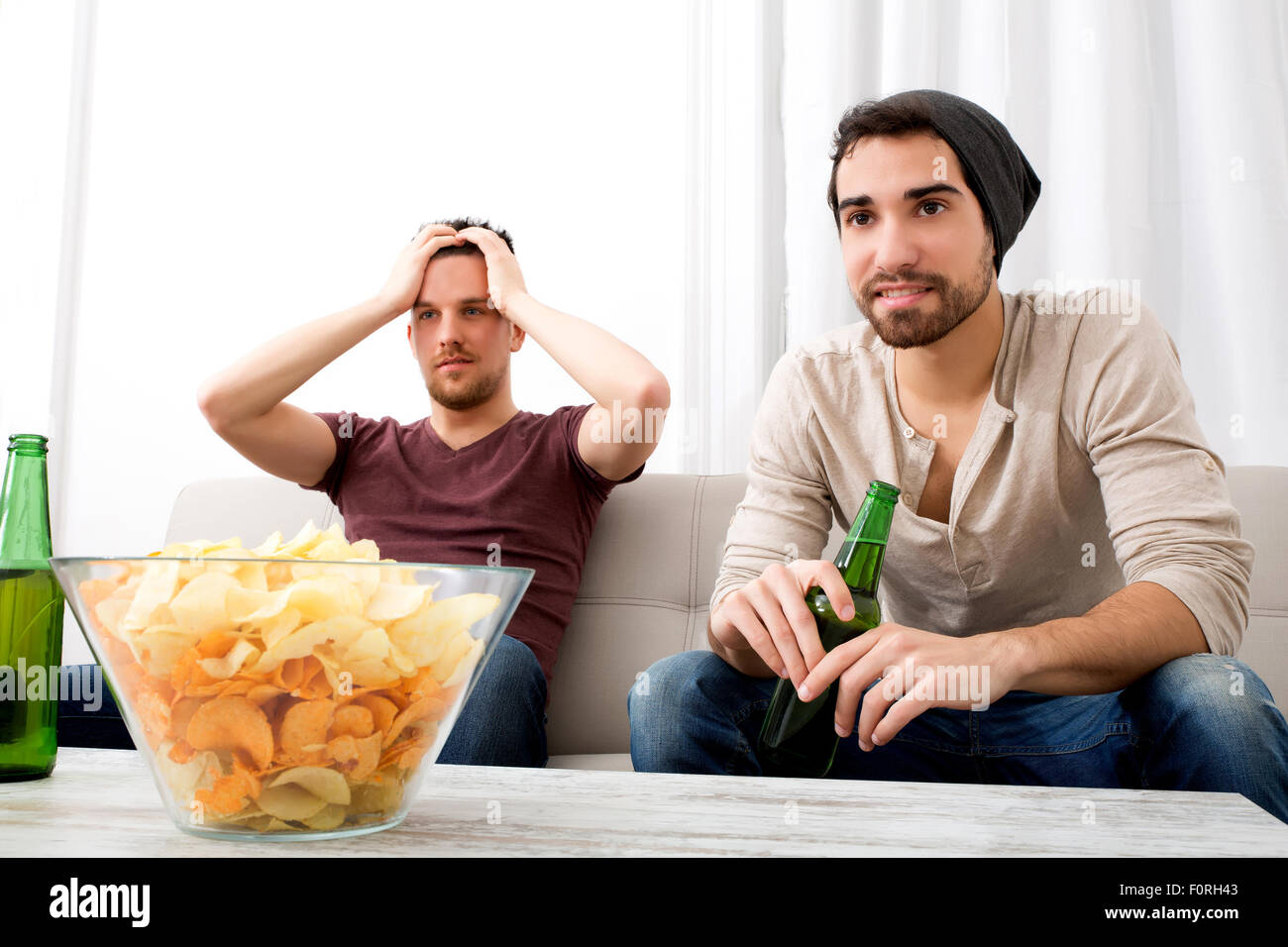 Men eating crisps hi-res stock photography and images - Alamy