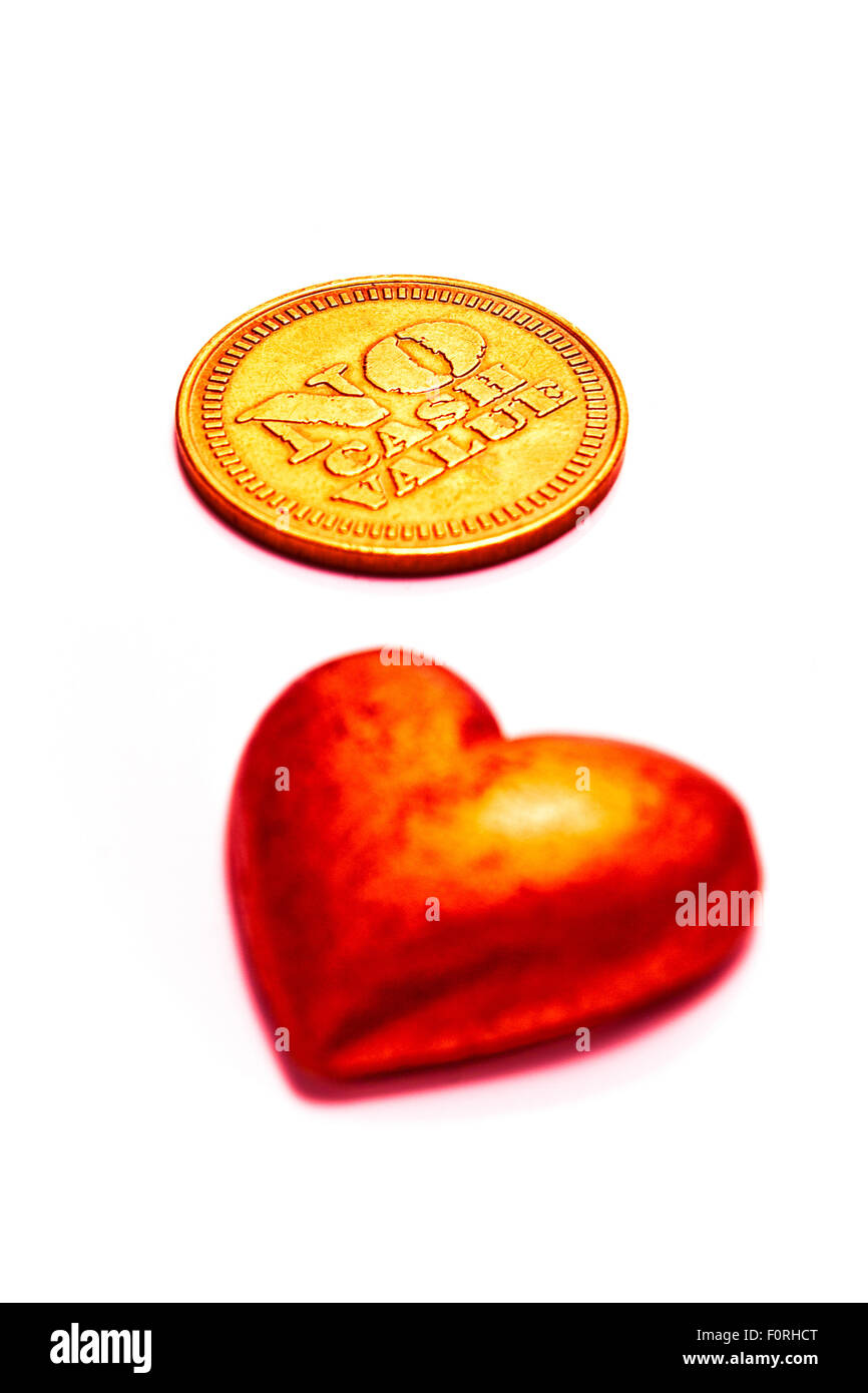 Coin and Heart isolated on white Stock Photo - Alamy