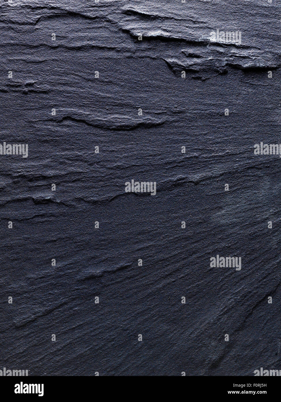 shot of slate background with directional lighting to emphasize texture ...