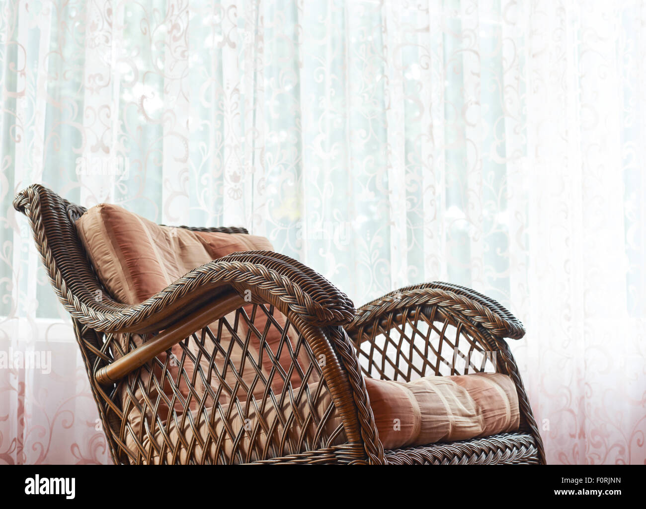 Wicker rocking chair composition Stock Photo - Alamy