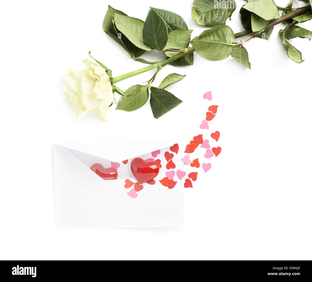 Rose and envelope filled with hearts Stock Photo - Alamy