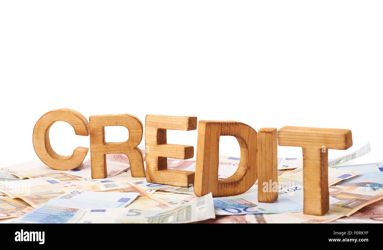 Word Credit over the pile of money Stock Photo - Alamy