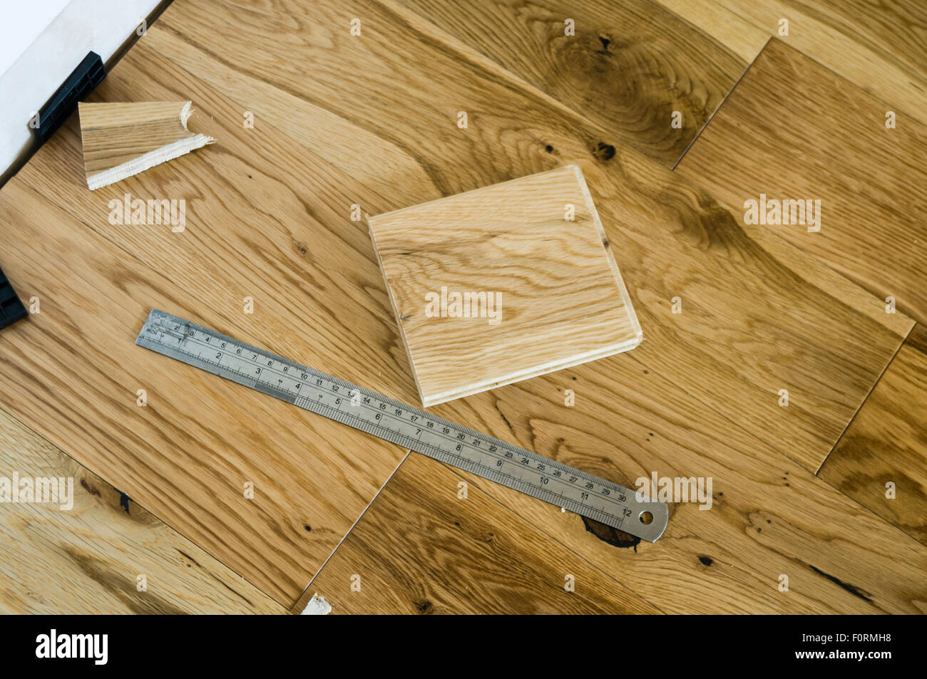 Wooden floor being laid Stock Photo - Alamy