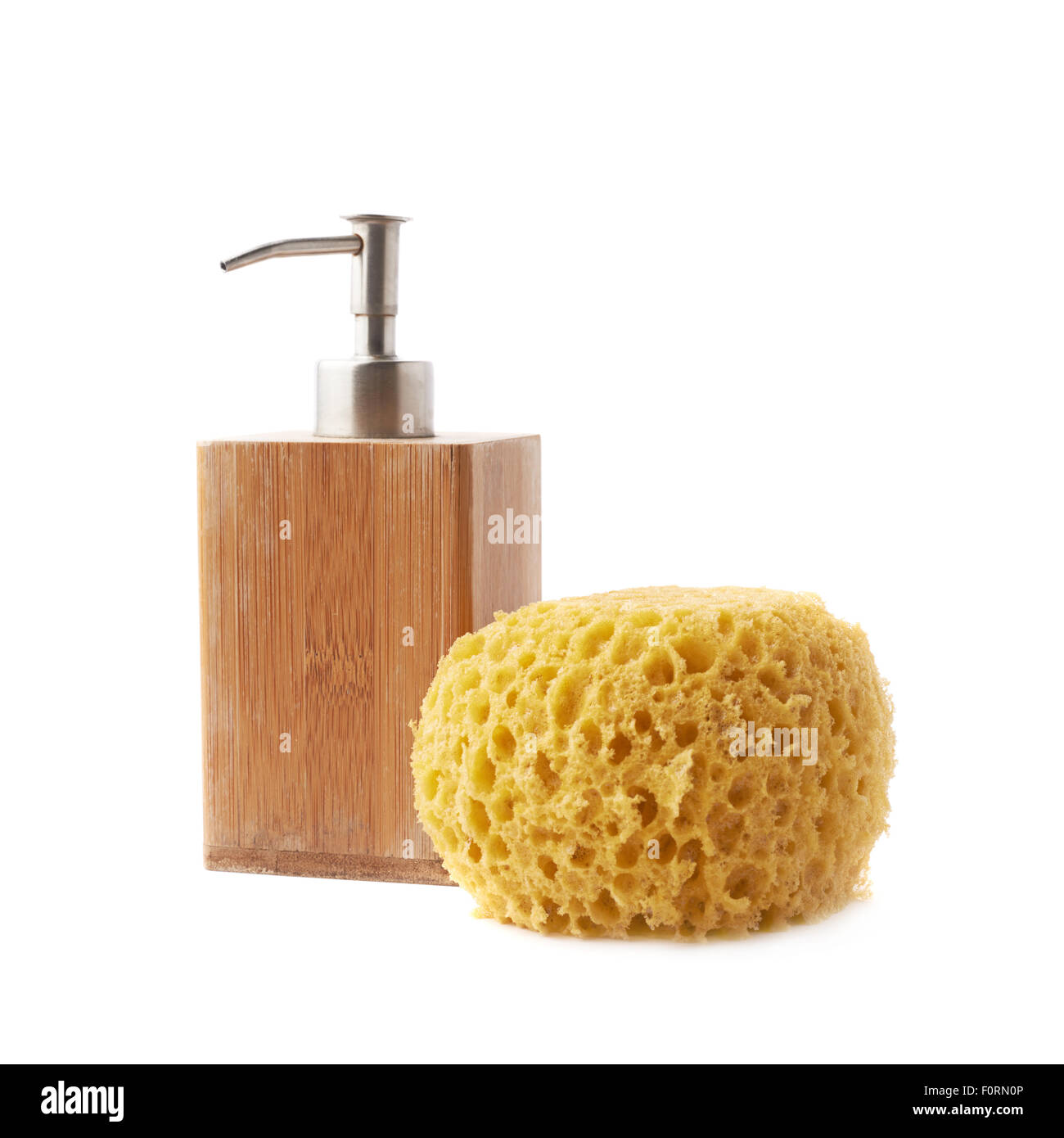 Soap dispenser and yellow sponge Stock Photo - Alamy